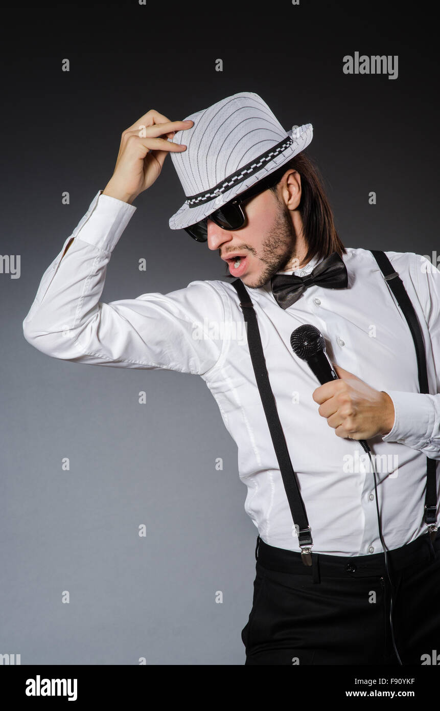 Funny singer with microphone at the concert Stock Photo - Alamy