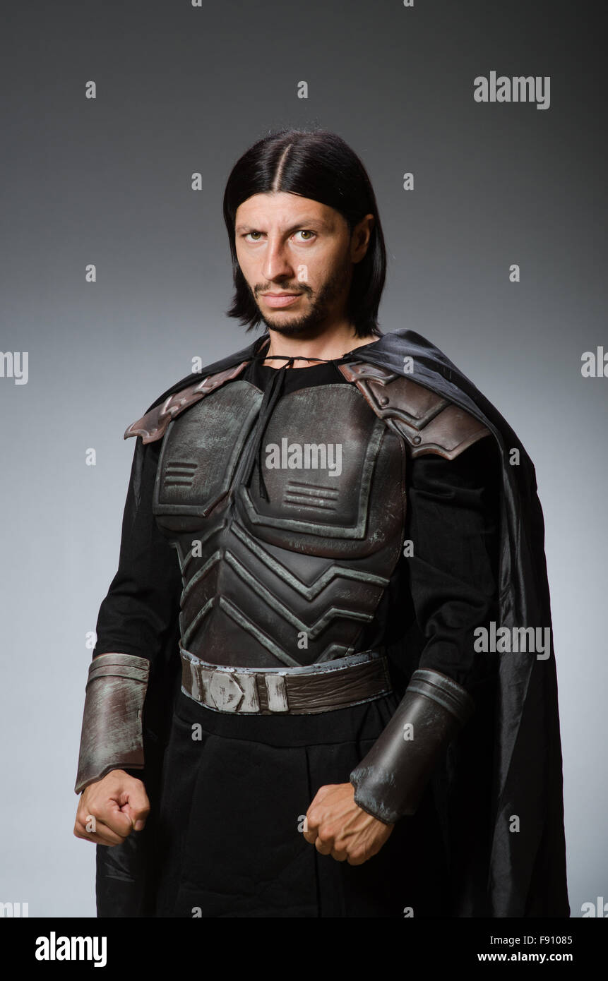 Angry warrior against dark background Stock Photo - Alamy