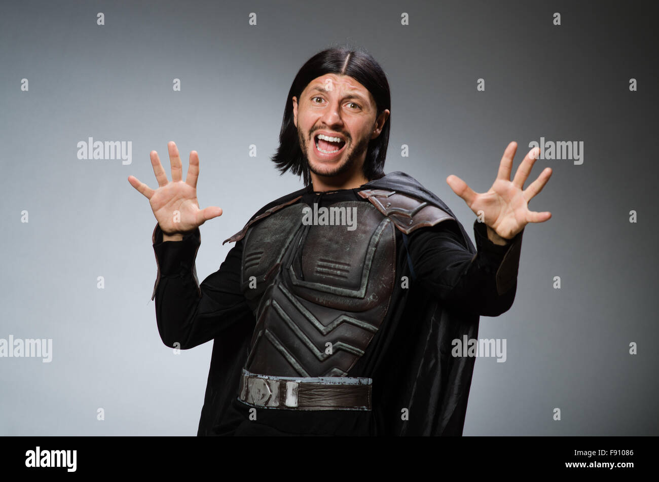 Funny knight against dark background Stock Photo - Alamy