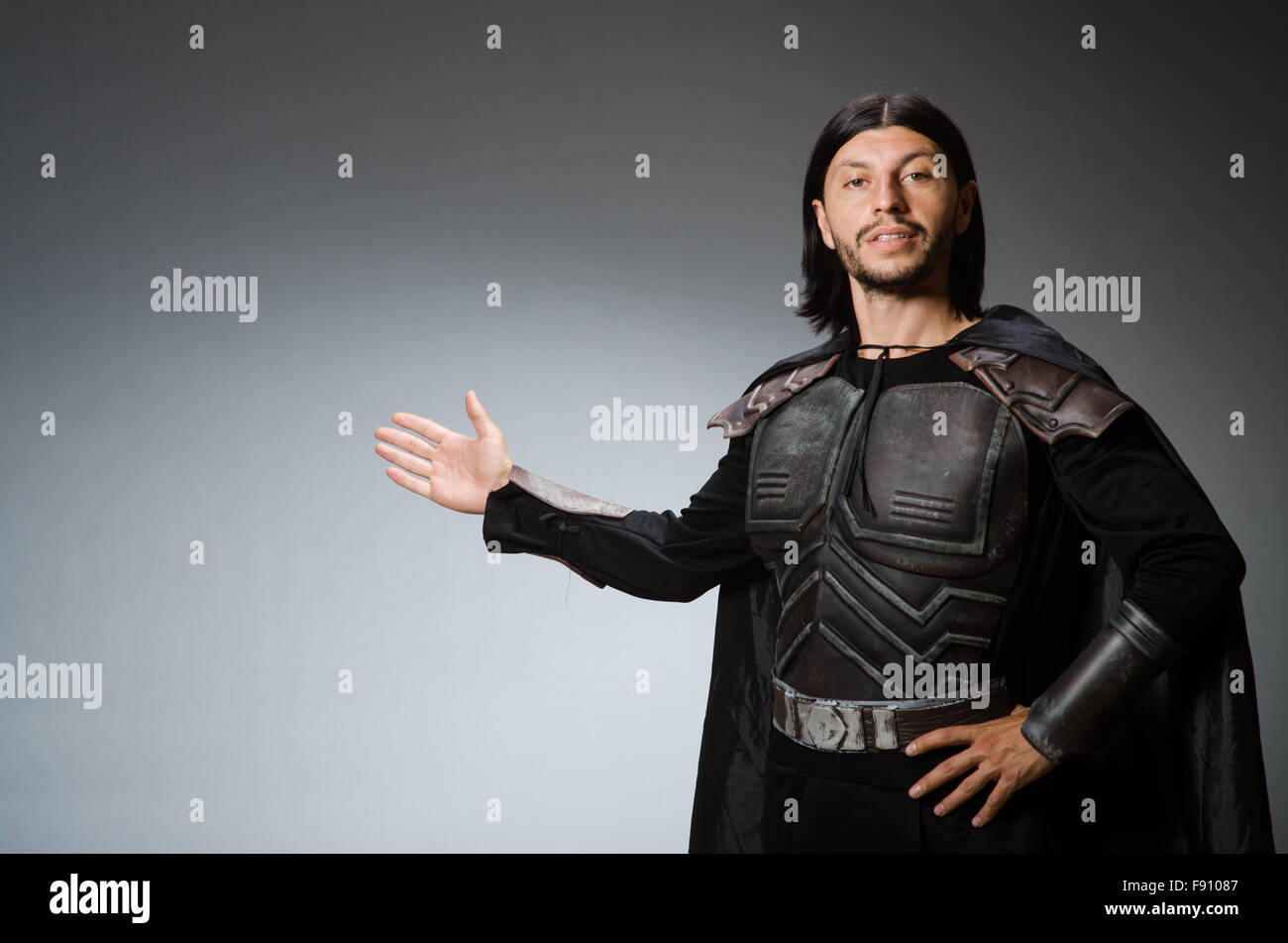 Funny knight against dark background Stock Photo - Alamy
