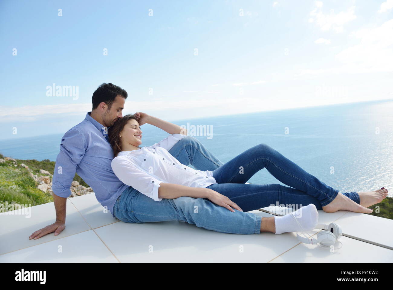 romantic happy young couple relax at modern home outdoors Stock Photo ...