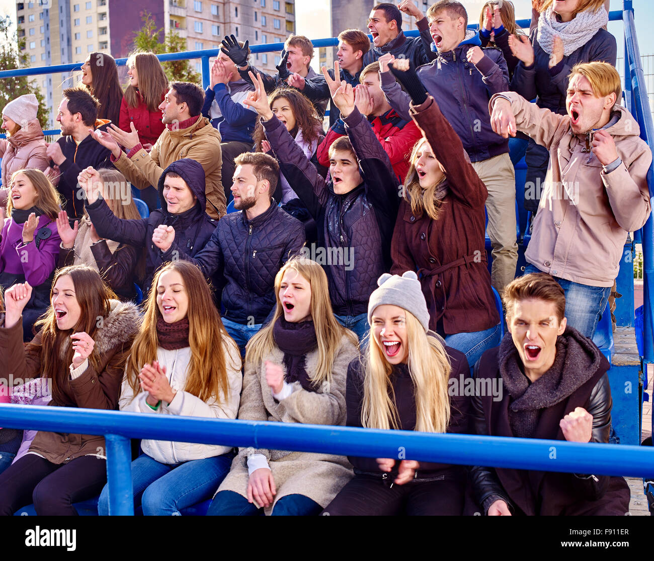 Sport fans clapping and singing on tribunes Stock Photo - Alamy