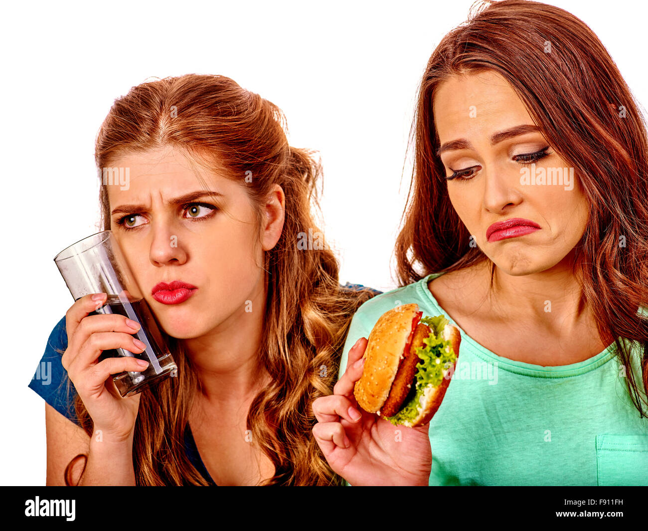 Unhappy couple girl eating fast food Stock Photo - Alamy