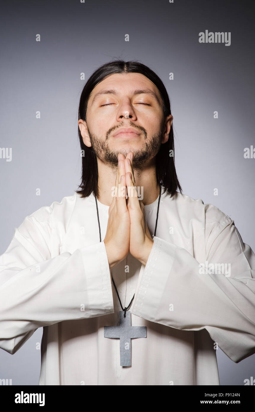 Priest man in religious concept Stock Photo - Alamy