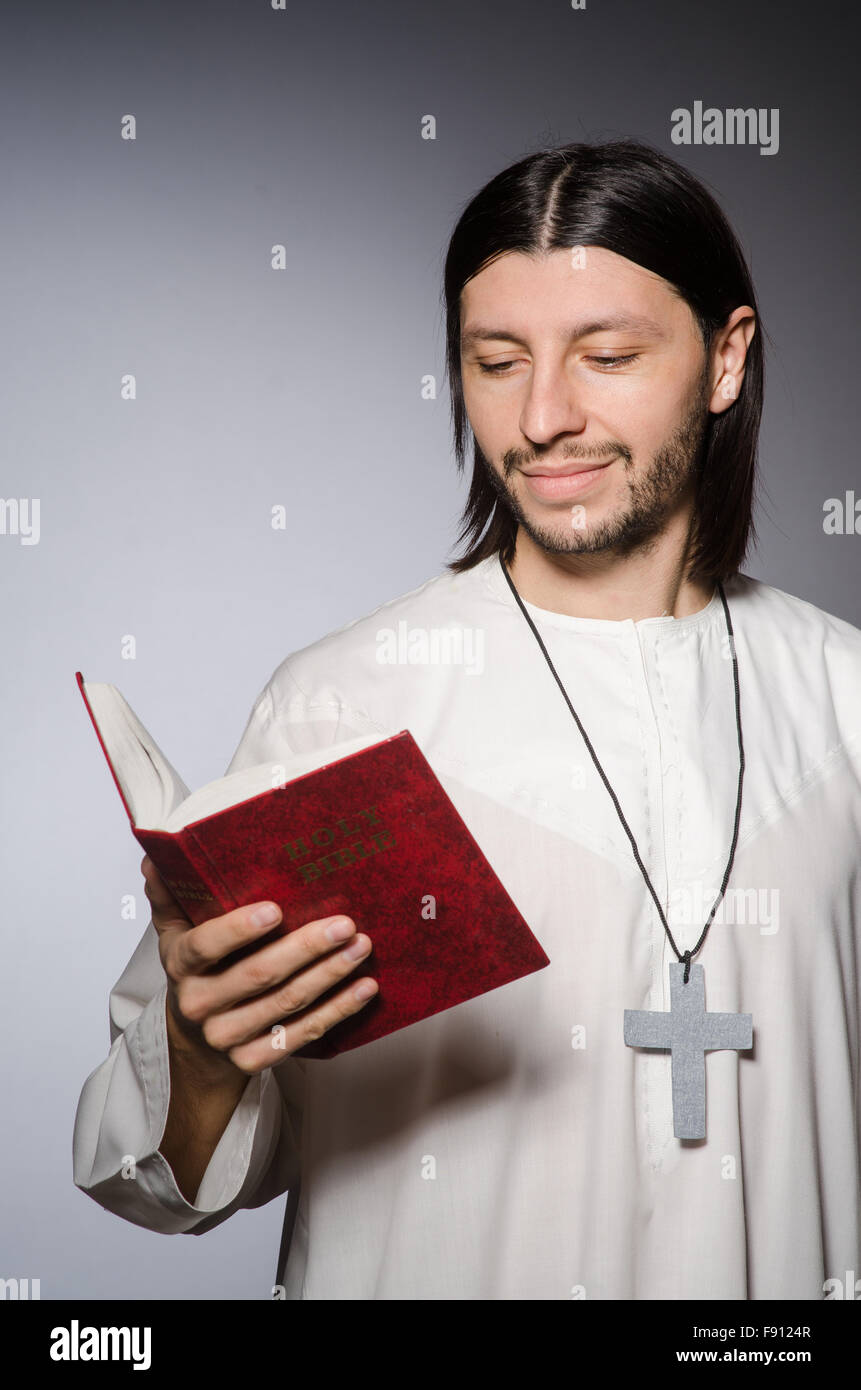 Priest man in religious concept Stock Photo - Alamy