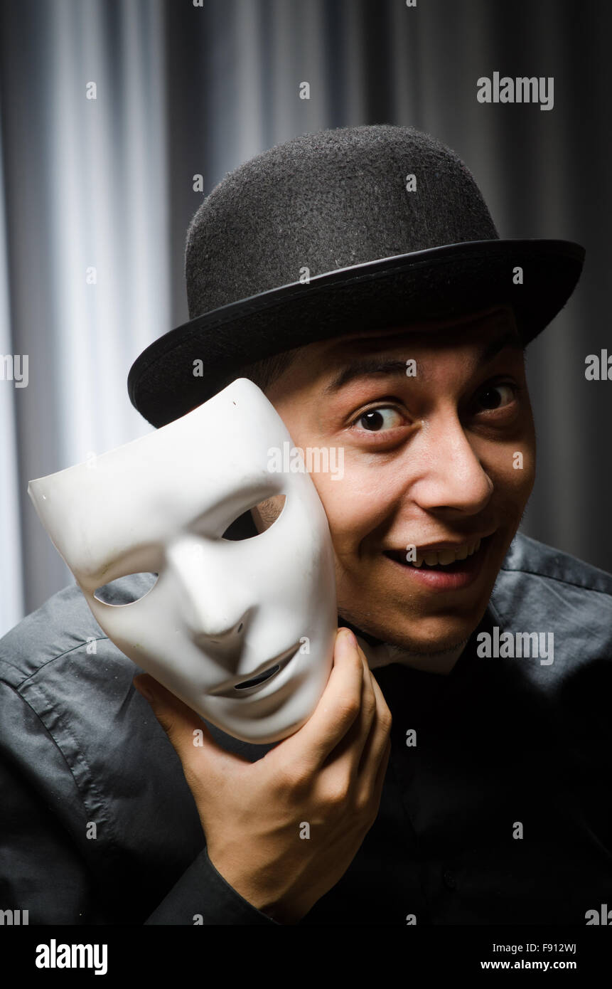 Funny concept with theatrical mask Stock Photo - Alamy