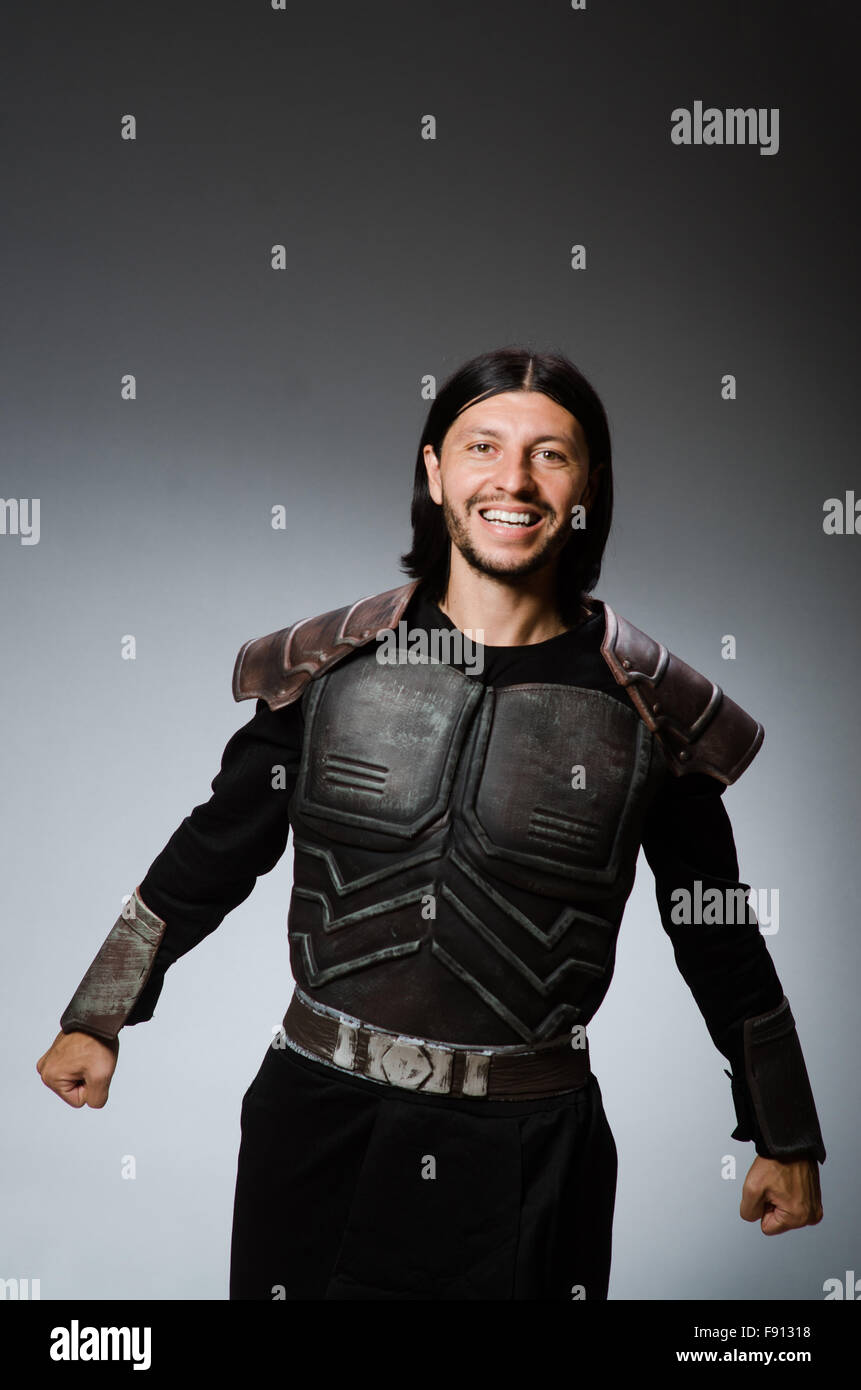 Angry warrior against dark background Stock Photo - Alamy