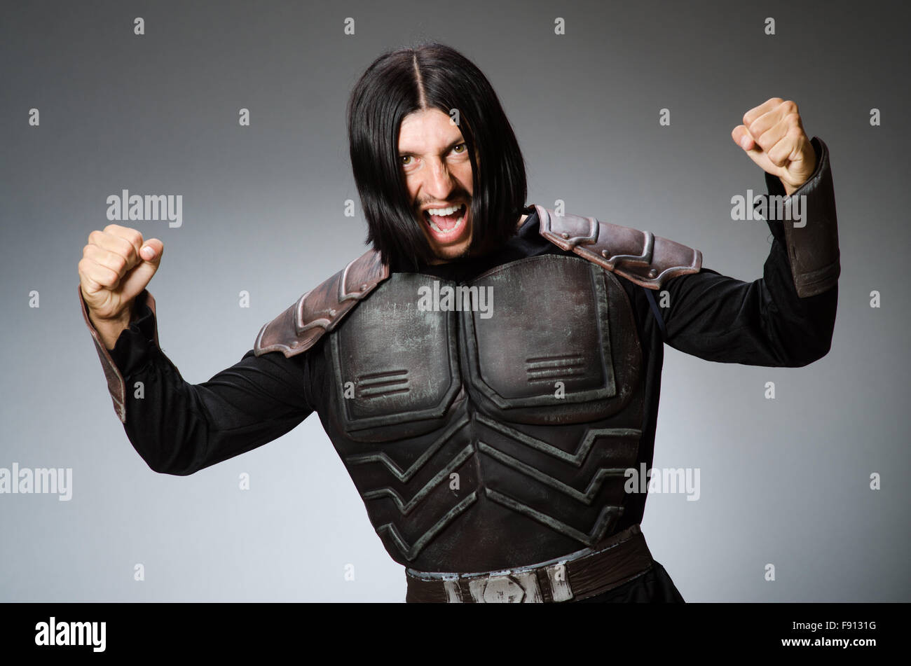 Angry warrior against dark background Stock Photo - Alamy