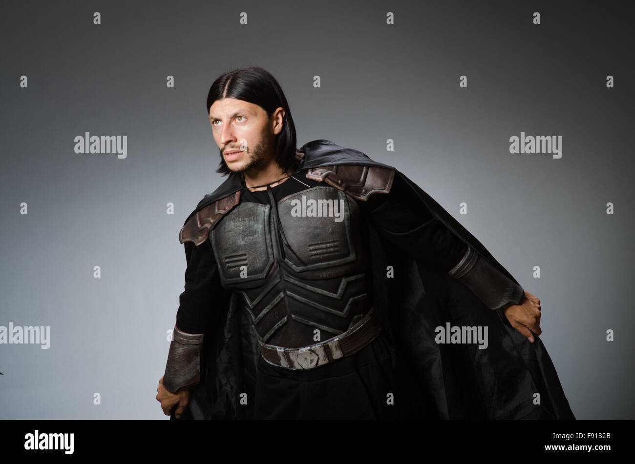 Angry warrior against dark background Stock Photo - Alamy