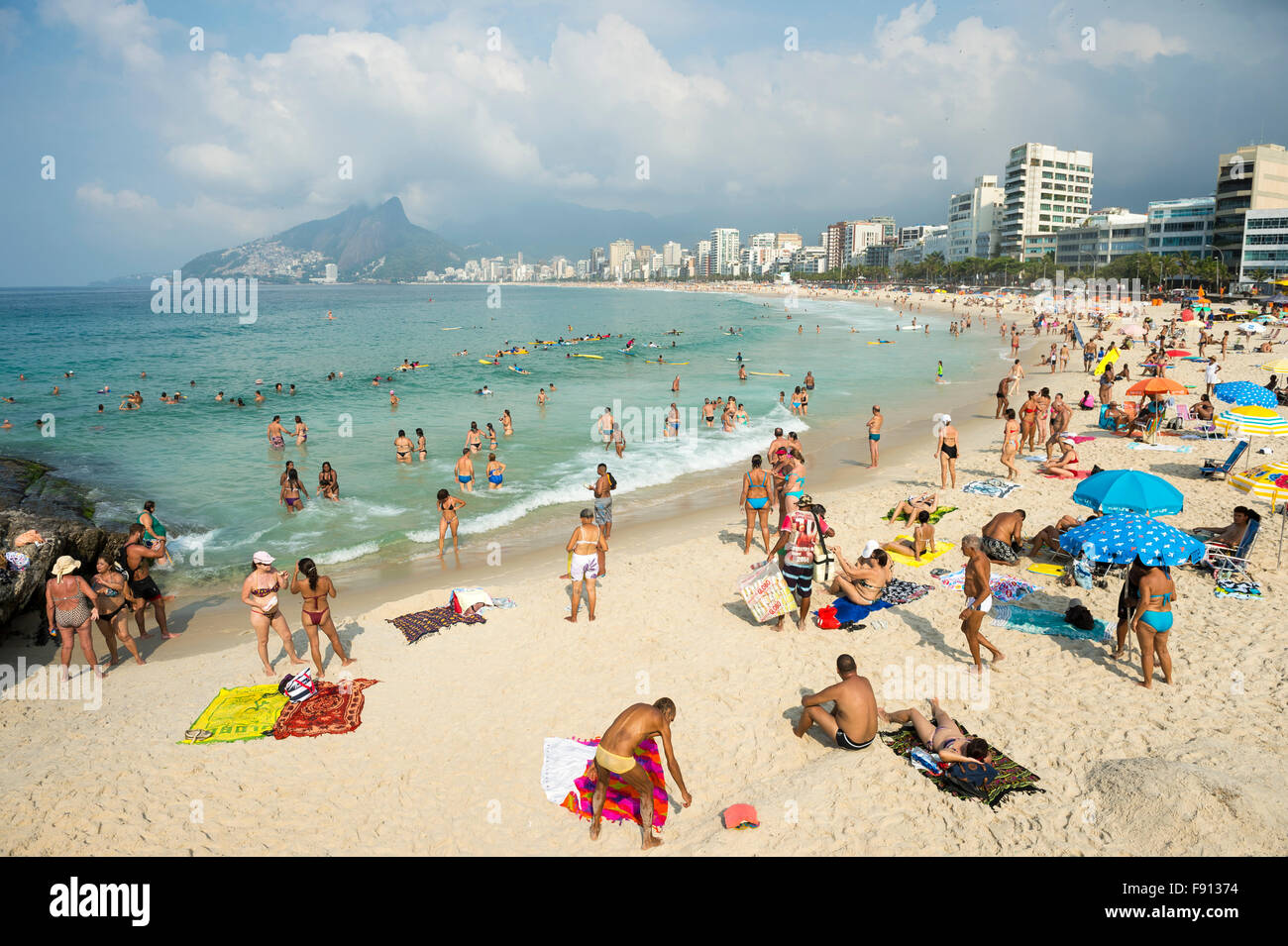 RIO DE JANEIRO, BRAZIL - MARCH 01, 2015: Beachgoers relax on a bright ...