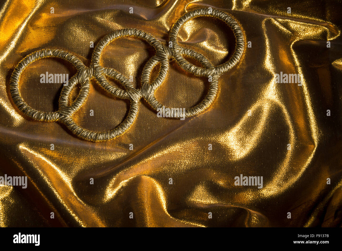 RIO DE JANEIRO, BRAZIL - FEBRUARY 3, 2015: Gold Olympic rings symbol ...