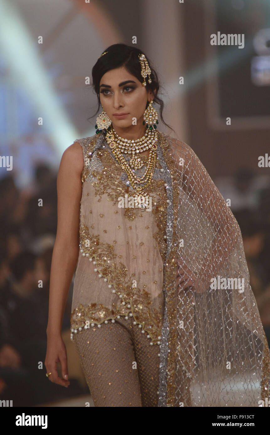 Lahore, Pakistan. 12th Dec, 2015. Pakistani model presents creations of ...