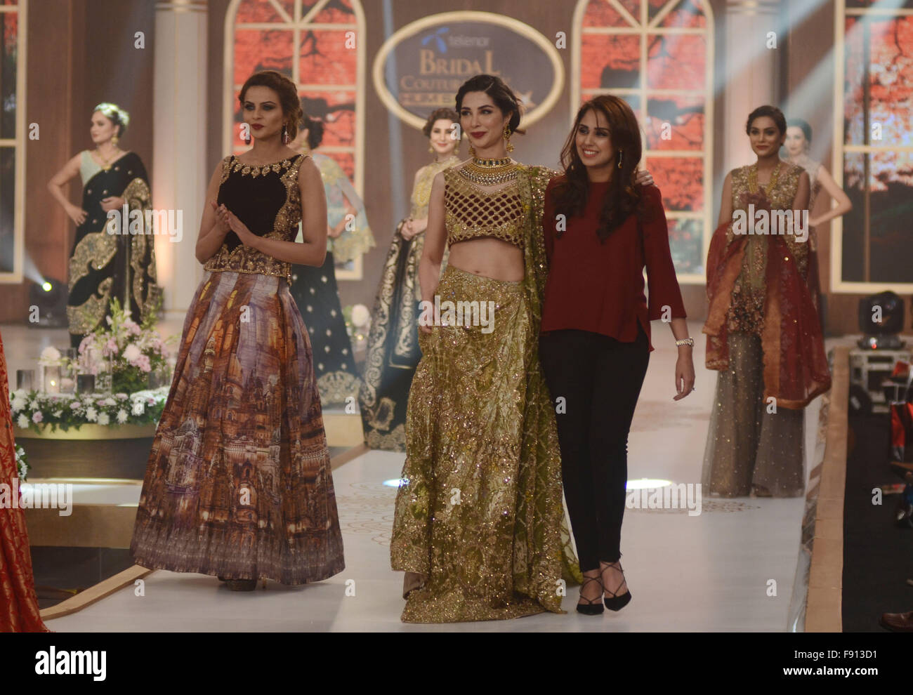 Lahore, Pakistan. 12th Dec, 2015. Pakistani models present creations of ...