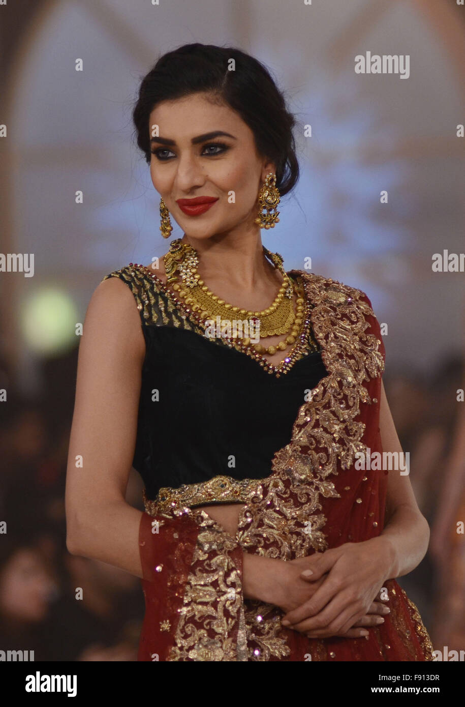 Lahore, Pakistan. 12th Dec, 2015. Pakistani model presents creations of ...