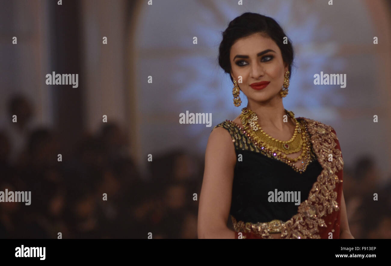 Lahore, Pakistan. 12th Dec, 2015. Pakistani model presents creations of ...