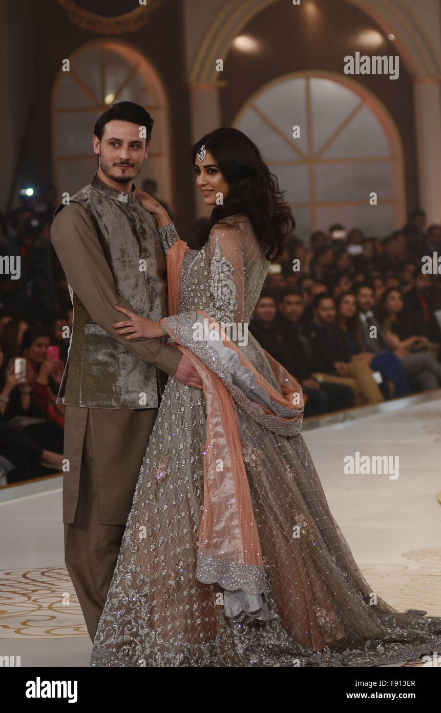 Lahore, Pakistan. 12th Dec, 2015. Pakistani models present creations of ...