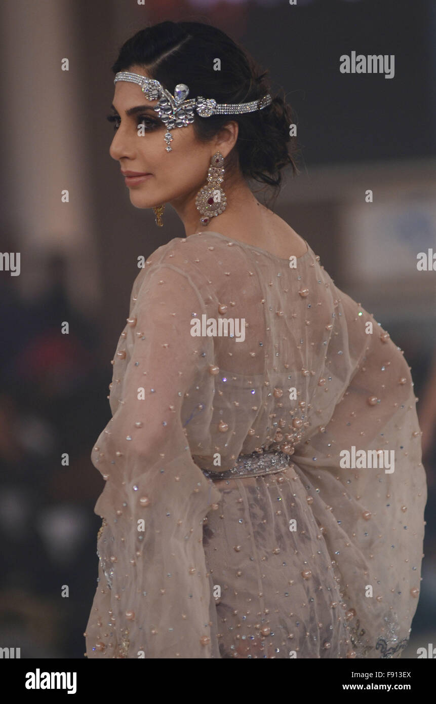 Lahore, Pakistan. 12th Dec, 2015. Pakistani model presents creations of ...