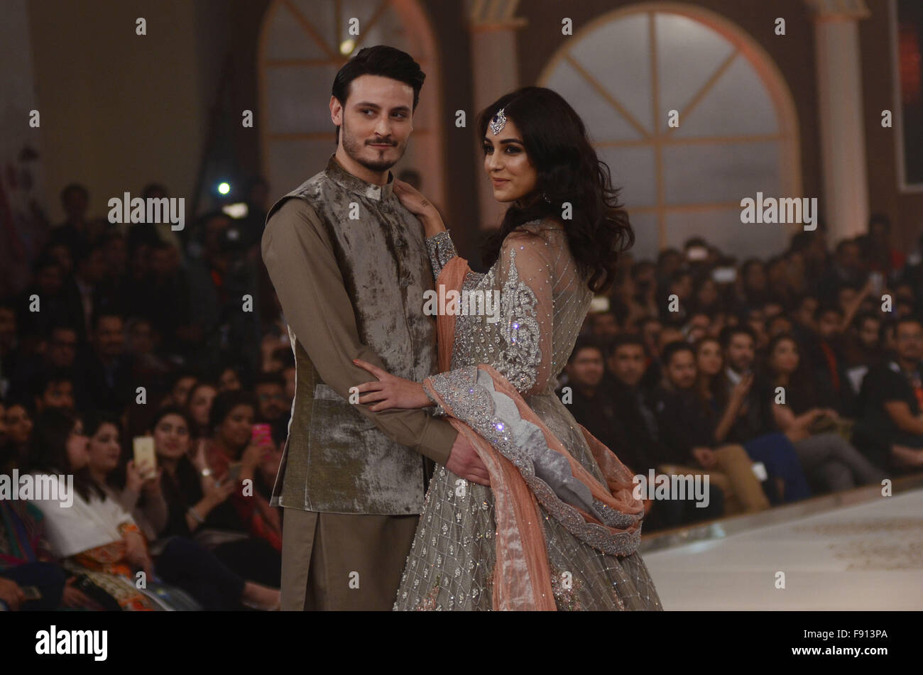 Lahore, Pakistan. 12th Dec, 2015. Pakistani models present creations of ...