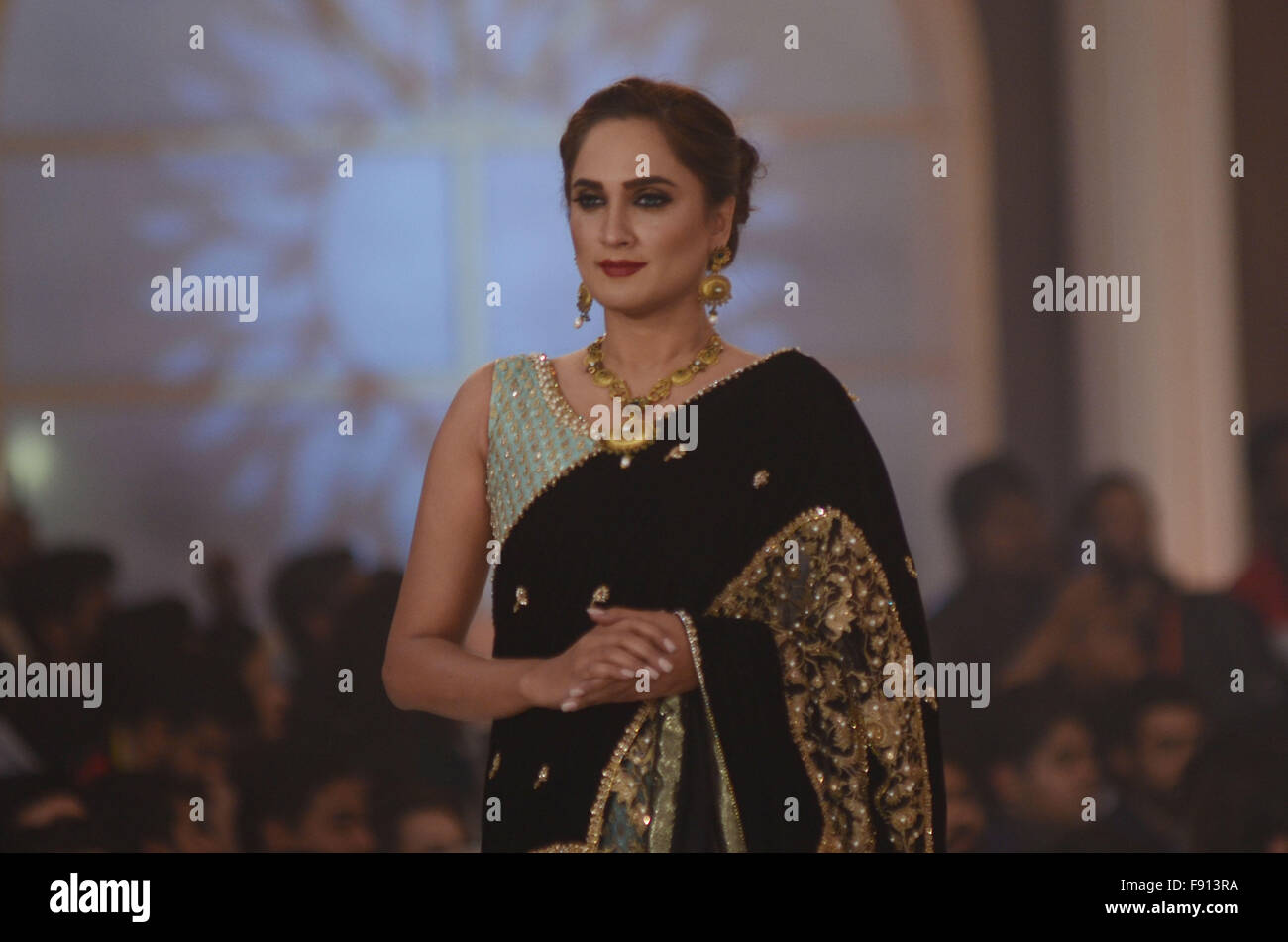Lahore, Pakistan. 12th Dec, 2015. Pakistani model presents creations of ...