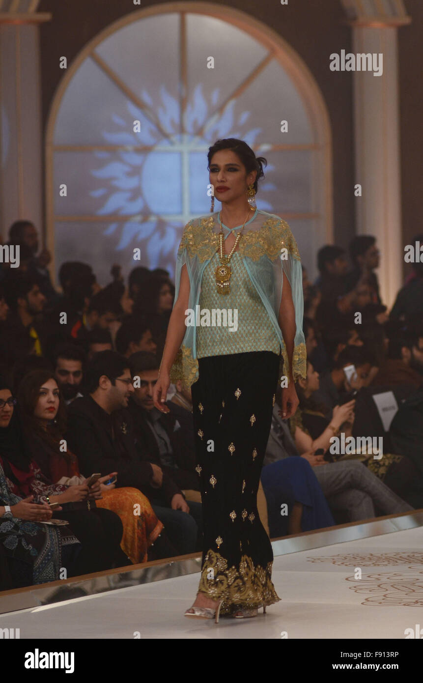 Lahore, Pakistan. 12th Dec, 2015. Pakistani model presents creations of ...