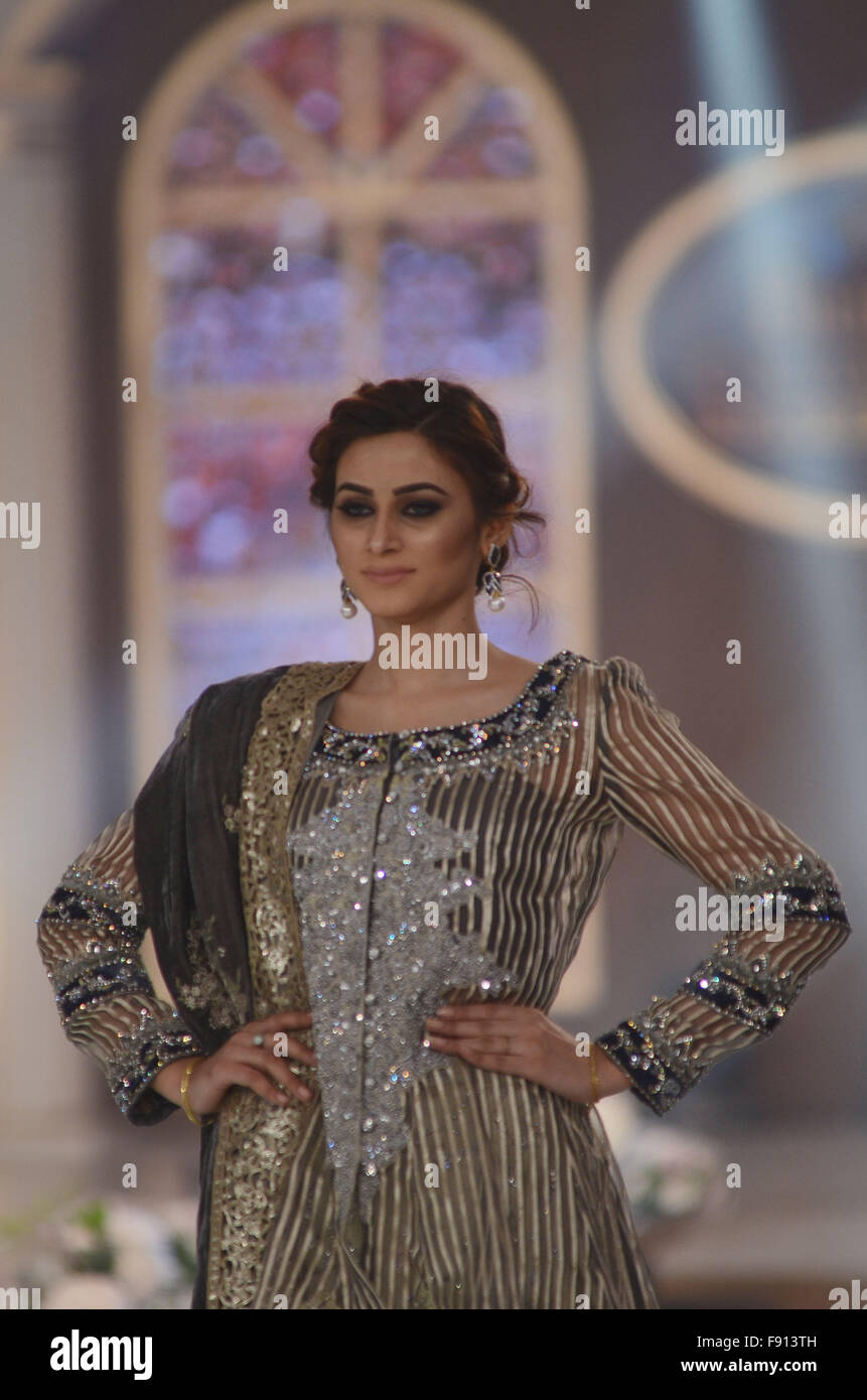 Lahore, Pakistan. 12th Dec, 2015. Pakistani model presents creations of ...