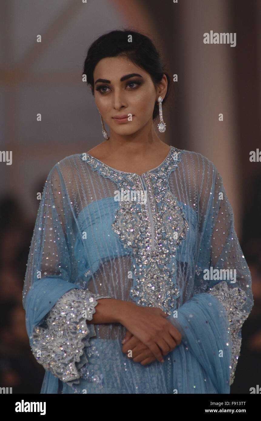 Lahore, Pakistan. 12th Dec, 2015. Pakistani model presents creations of ...
