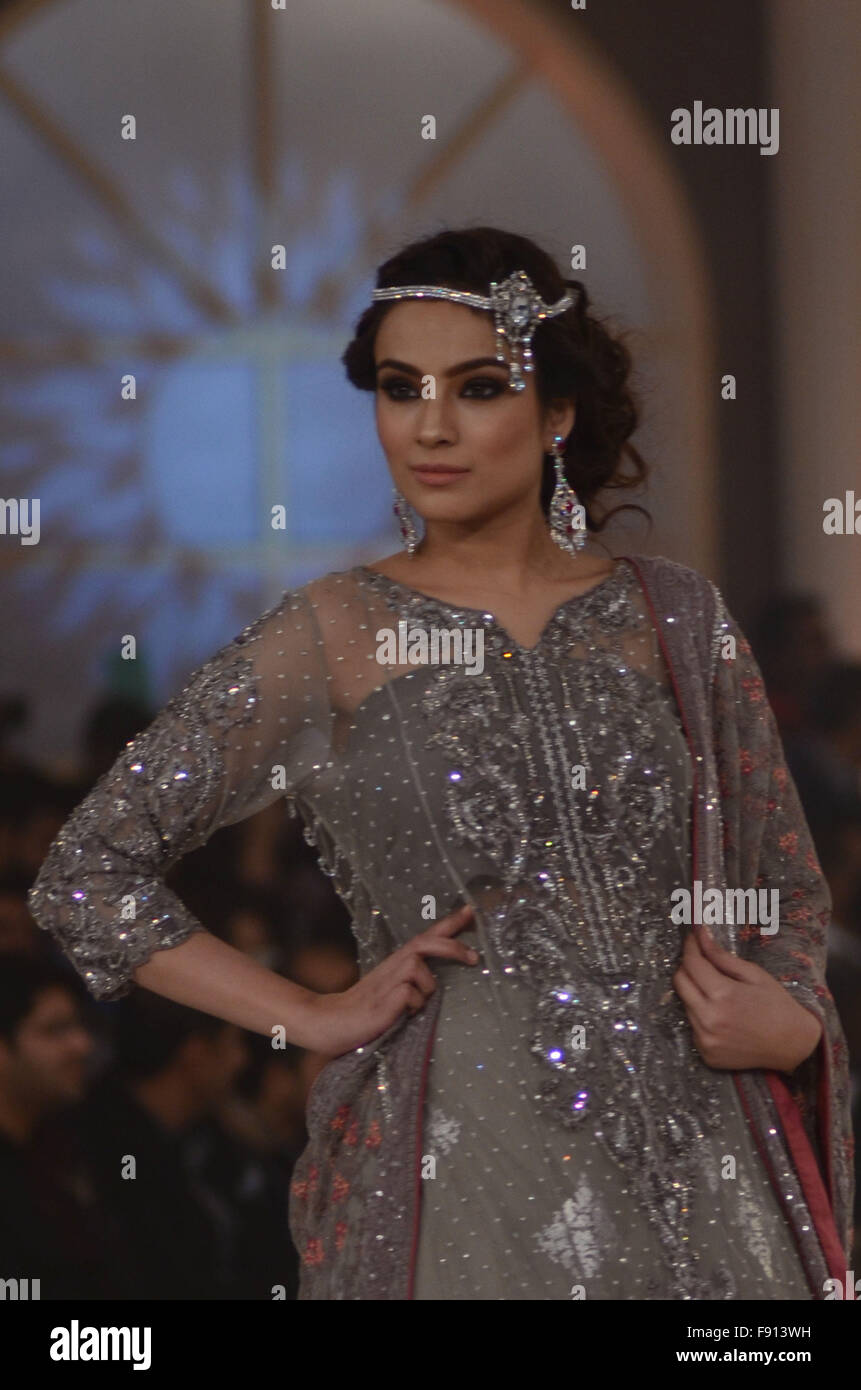 Lahore, Pakistan. 12th Dec, 2015. Pakistani model presents creations of ...
