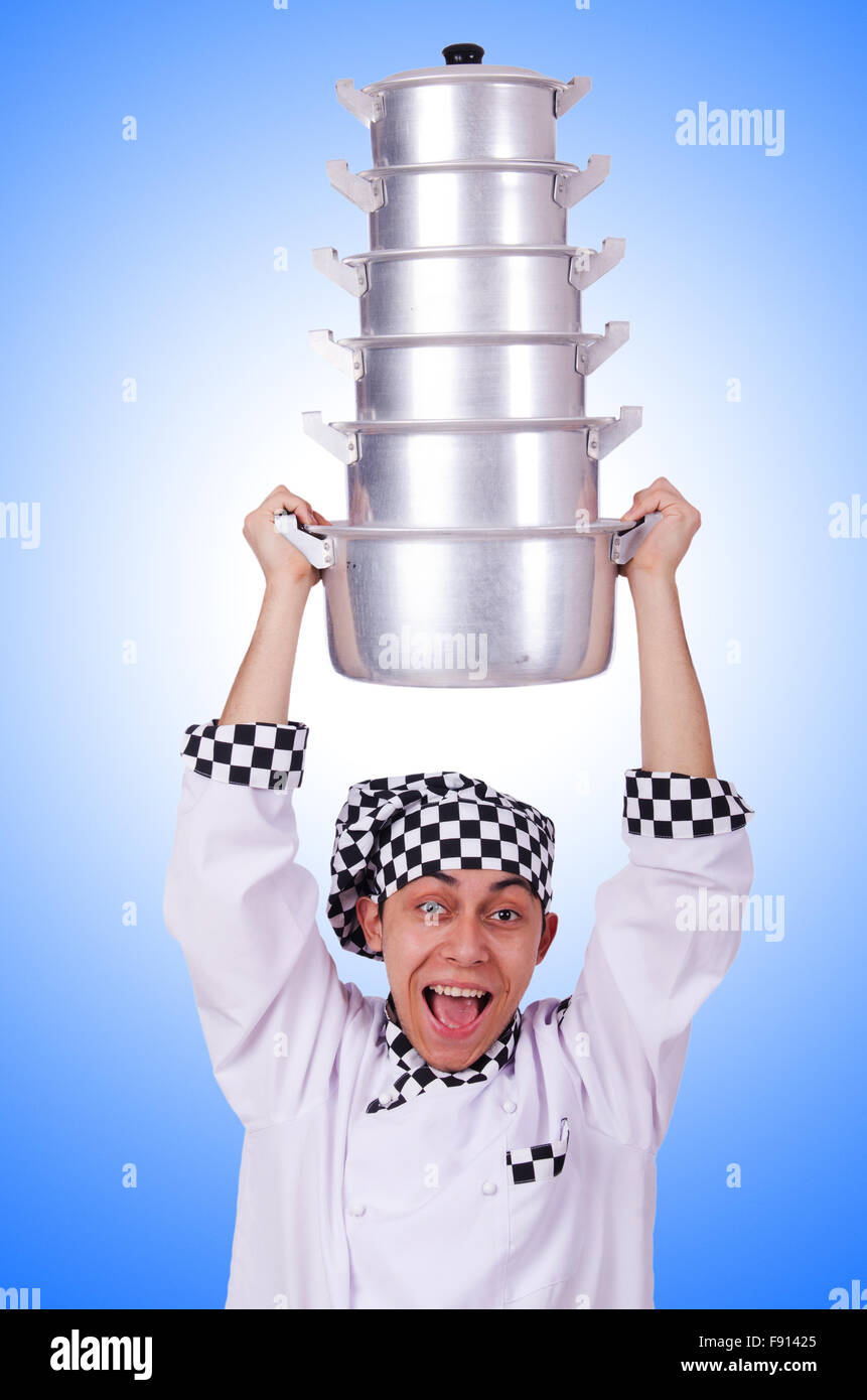 Cook with stack of pots on white Stock Photo - Alamy