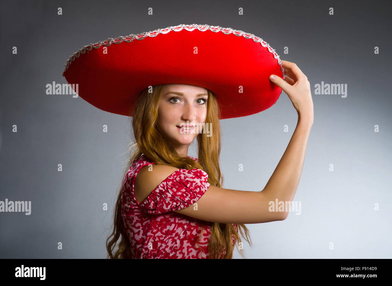 Mexican woman wearing red sombrero Stock Photo - Alamy