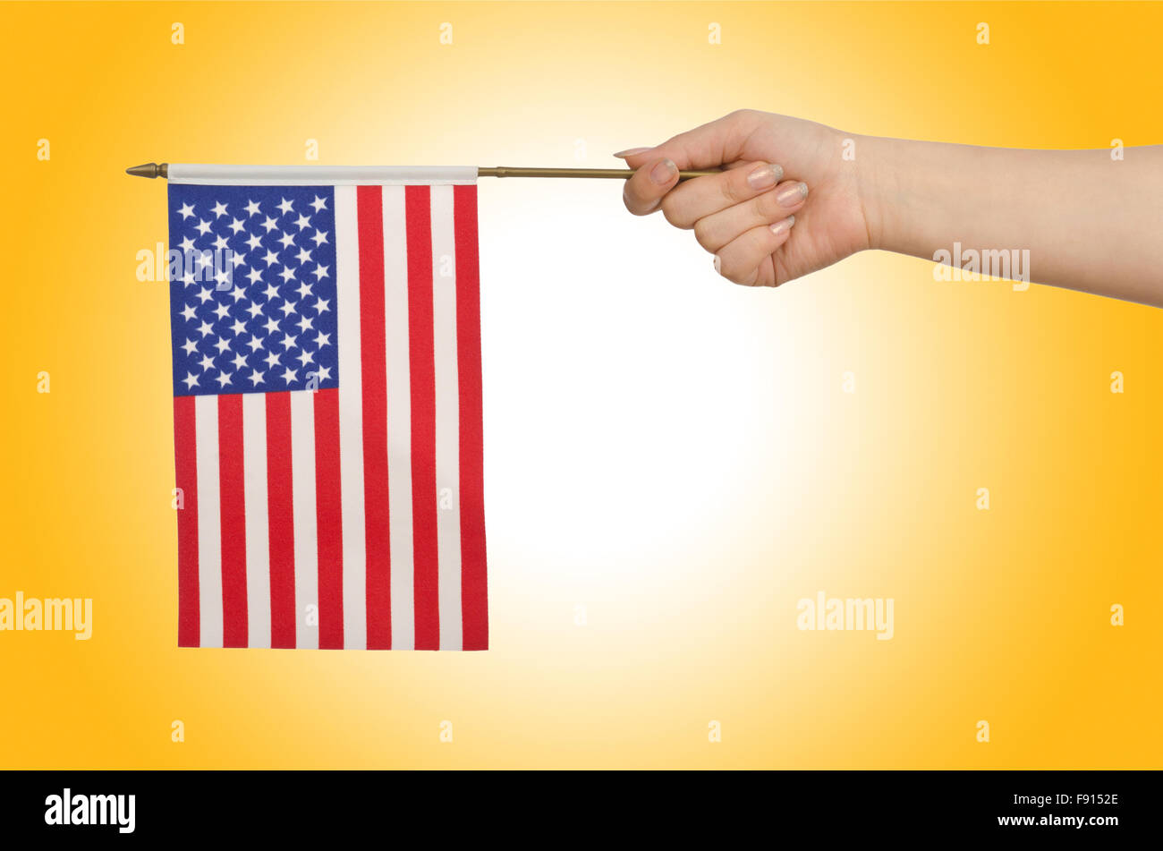 Hand holding american flag on white Stock Photo - Alamy