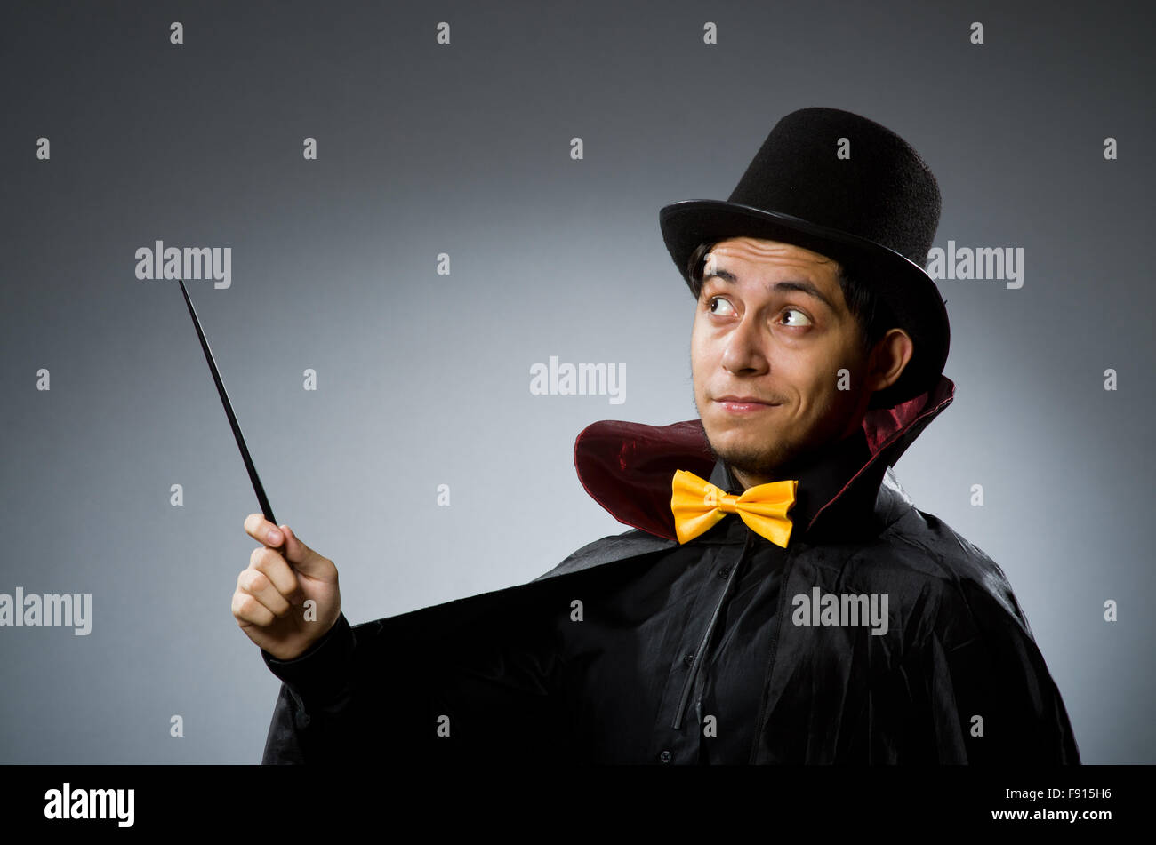 Funny magician man with wand and hat Stock Photo - Alamy