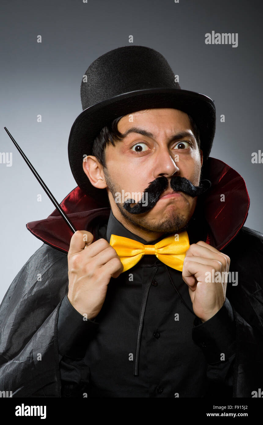 Funny magician man with wand and hat Stock Photo - Alamy