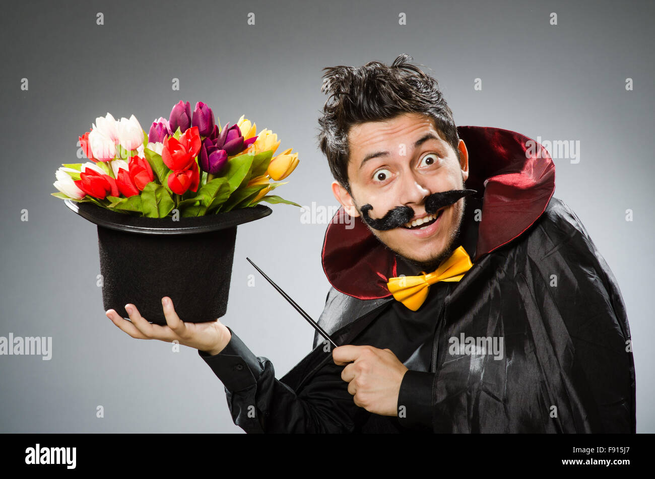 Funny magician man with wand and hat Stock Photo - Alamy