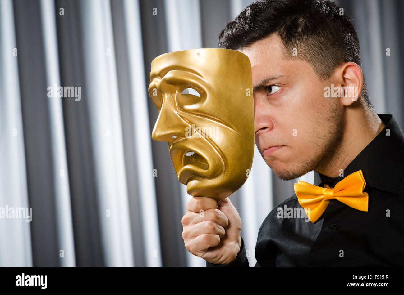 Funny concept with theatrical mask Stock Photo - Alamy