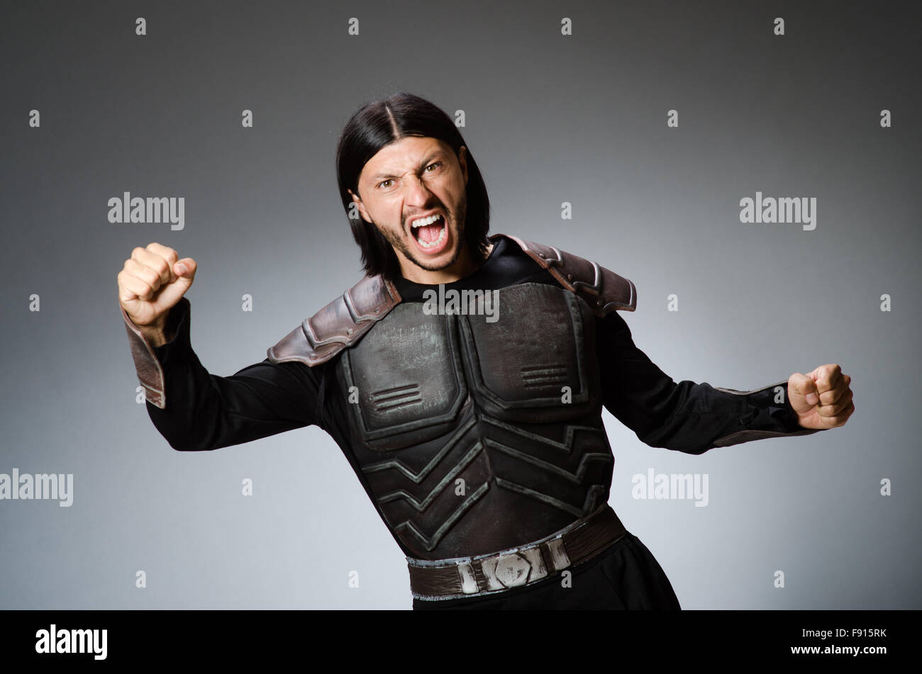 Angry warrior against dark background Stock Photo - Alamy