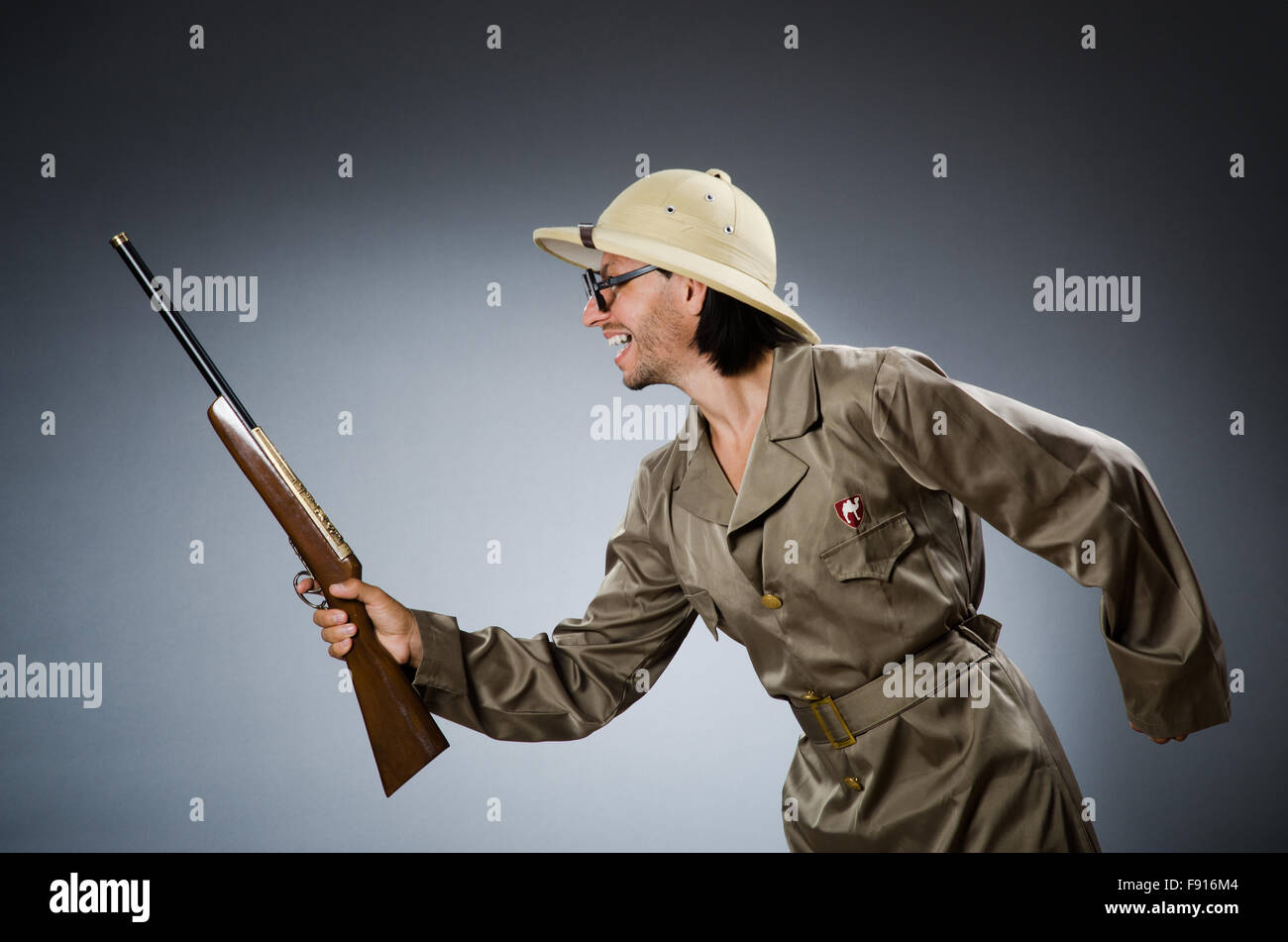 Funny safari hunter with rifle Stock Photo - Alamy