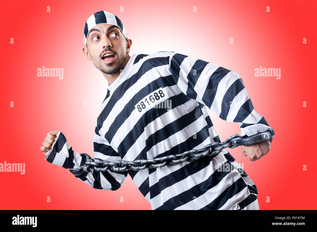 Convict criminal in striped uniform Stock Photo - Alamy