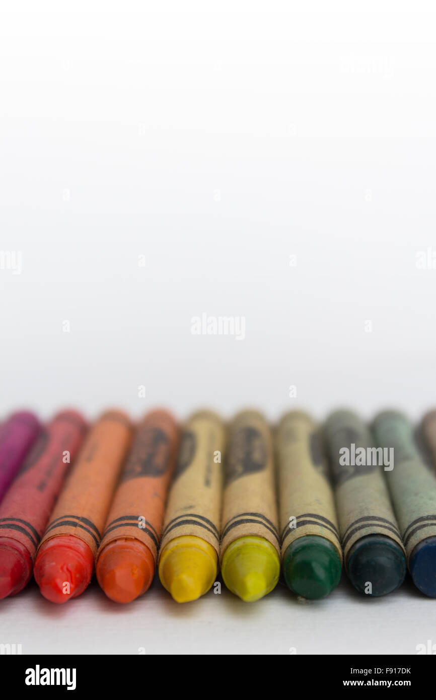 group of old wax crayons on white paper - vintage crayons many colors ...