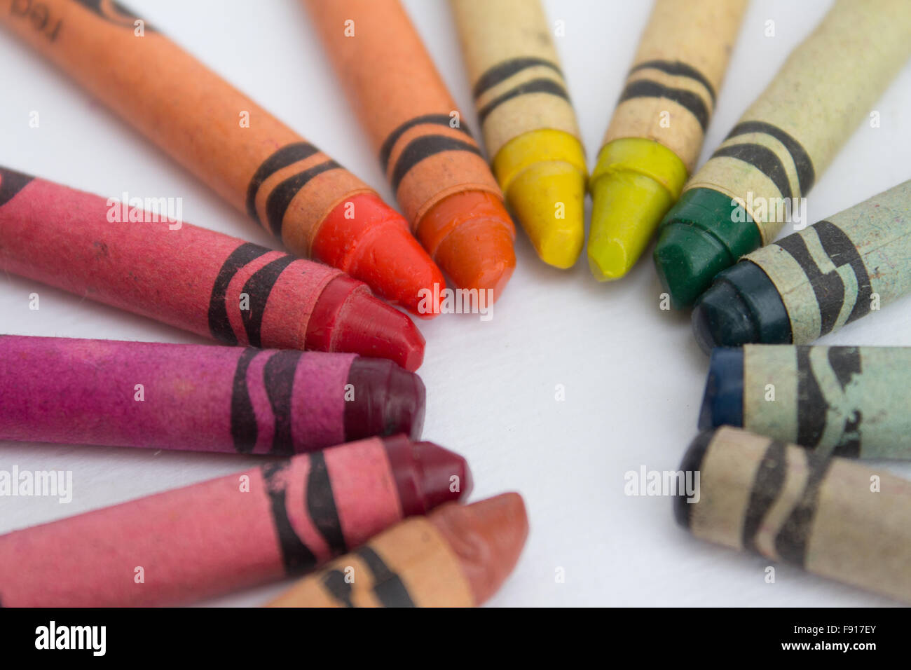 group of old wax crayons on white paper - vintage crayons many colors ...