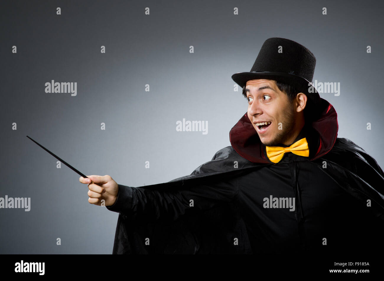 Funny magician man with wand and hat Stock Photo - Alamy
