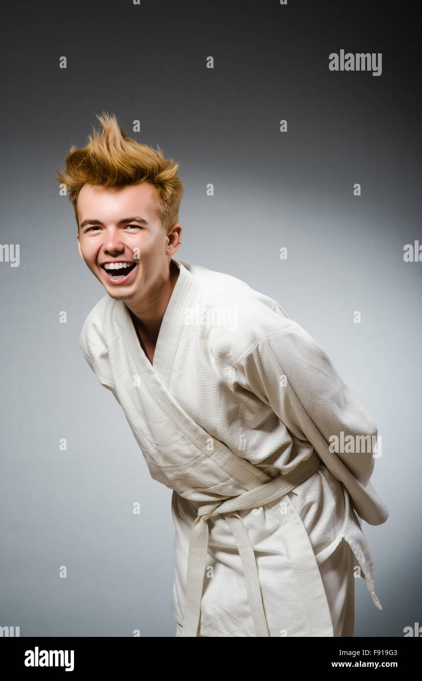 Funny karate fighter wearing white kimono Stock Photo - Alamy