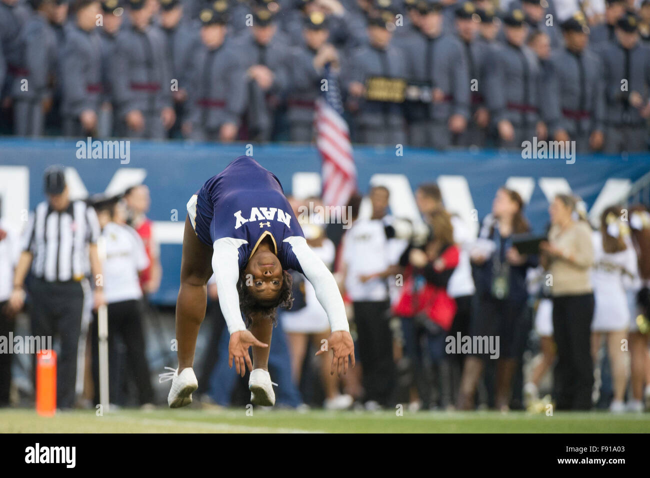 Philadelphia, PA, USA. 12th Dec, 2015. A Navy Midshipmen cheerleader ...