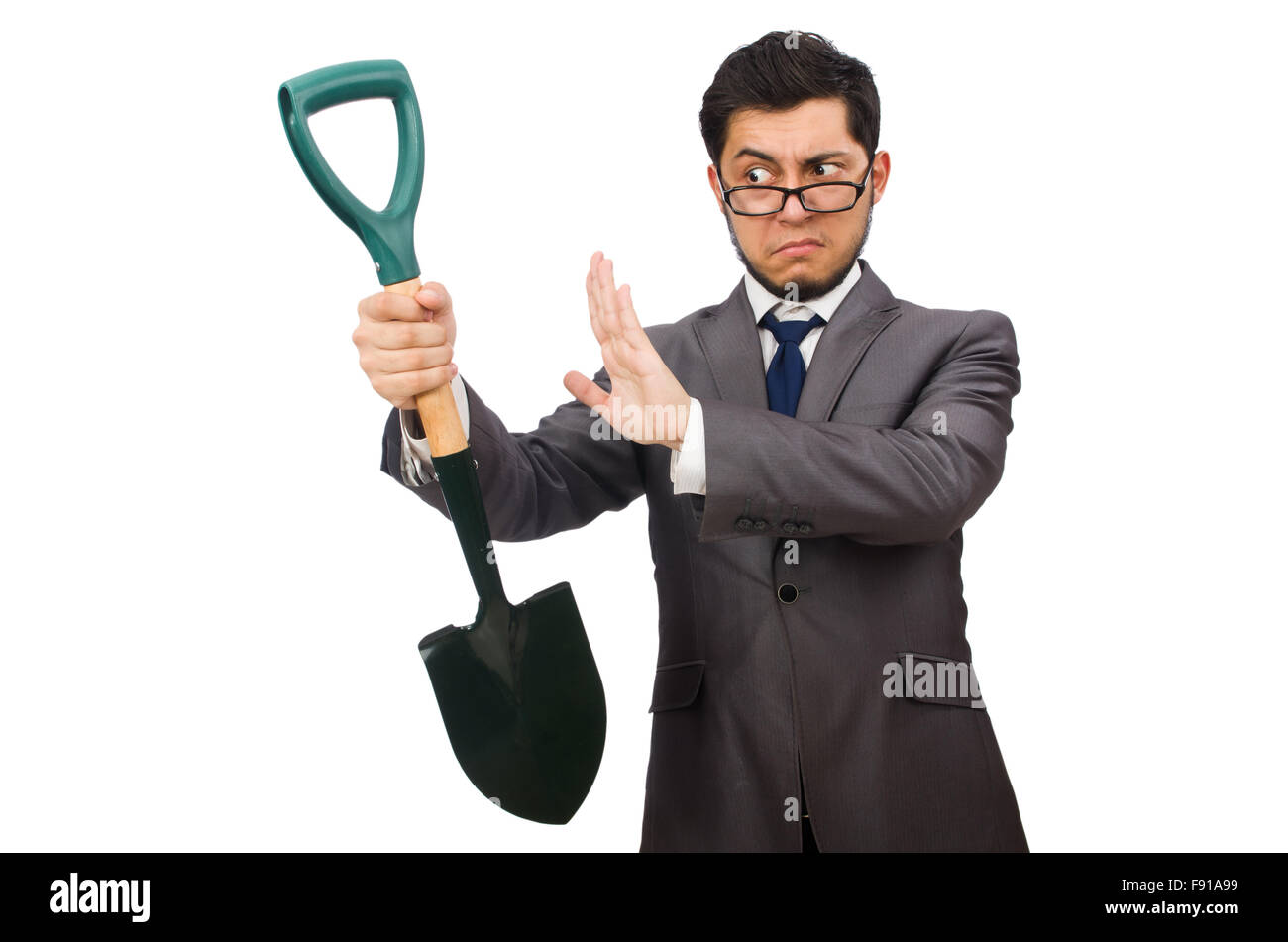 Young businessman holding a tool isolated on white Stock Photo - Alamy