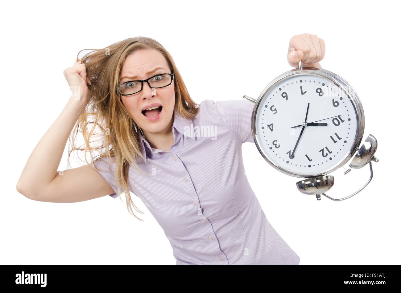 Young employee holding alarm clock isolated on white Stock Photo - Alamy