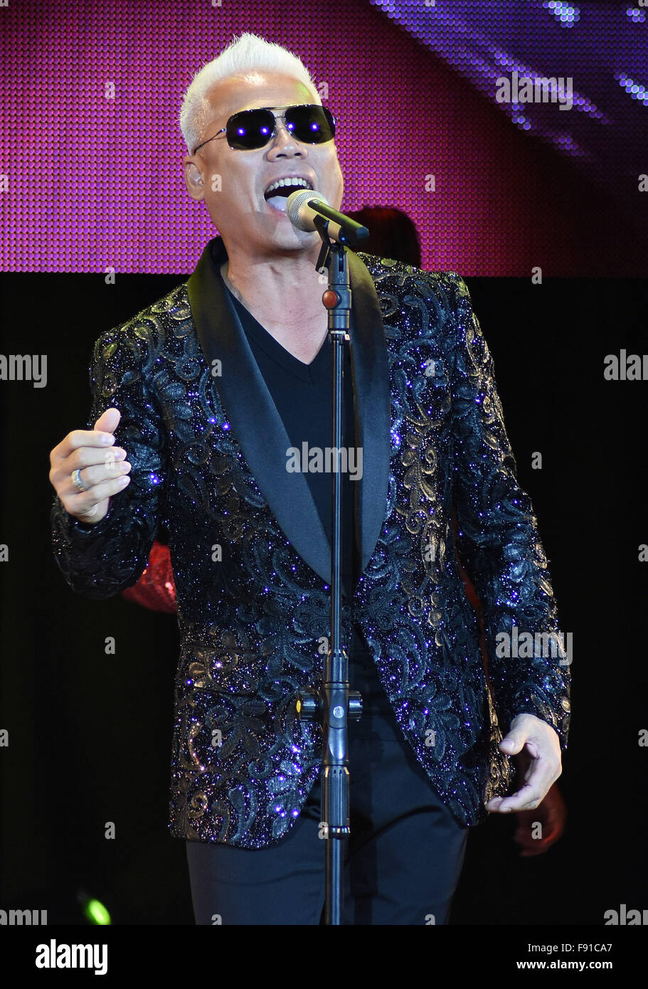 Taipei. 13th Dec, 2015. Singer Eric Moo sings at his solo concert in ...