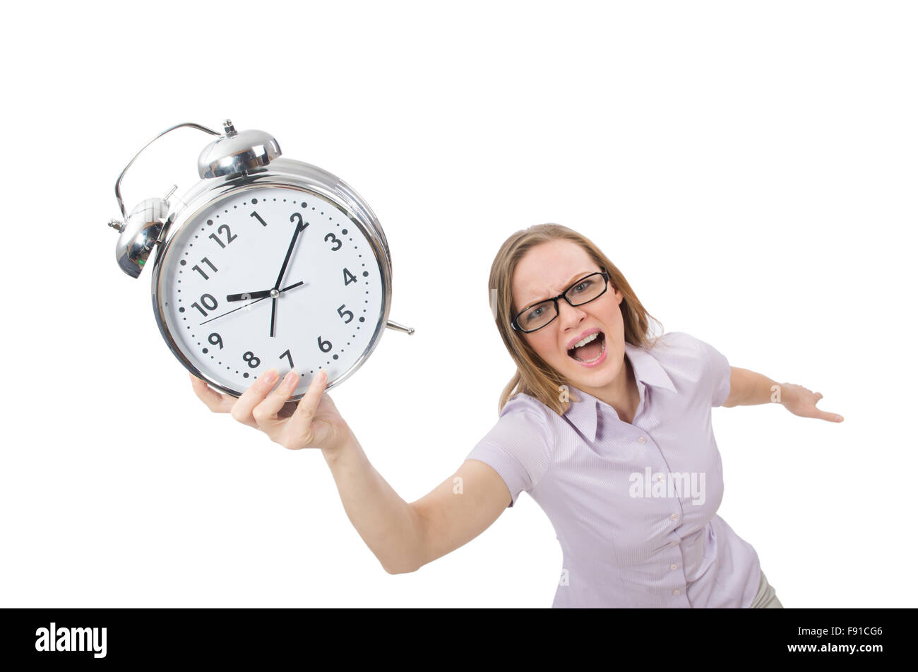 Young employee holding alarm clock isolated on white Stock Photo - Alamy