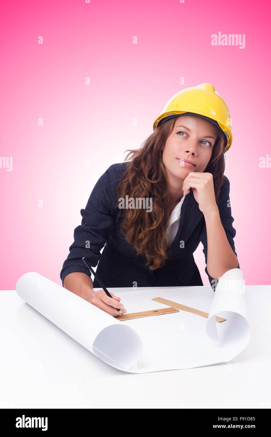 Woman architect with drawings against gradient Stock Photo - Alamy