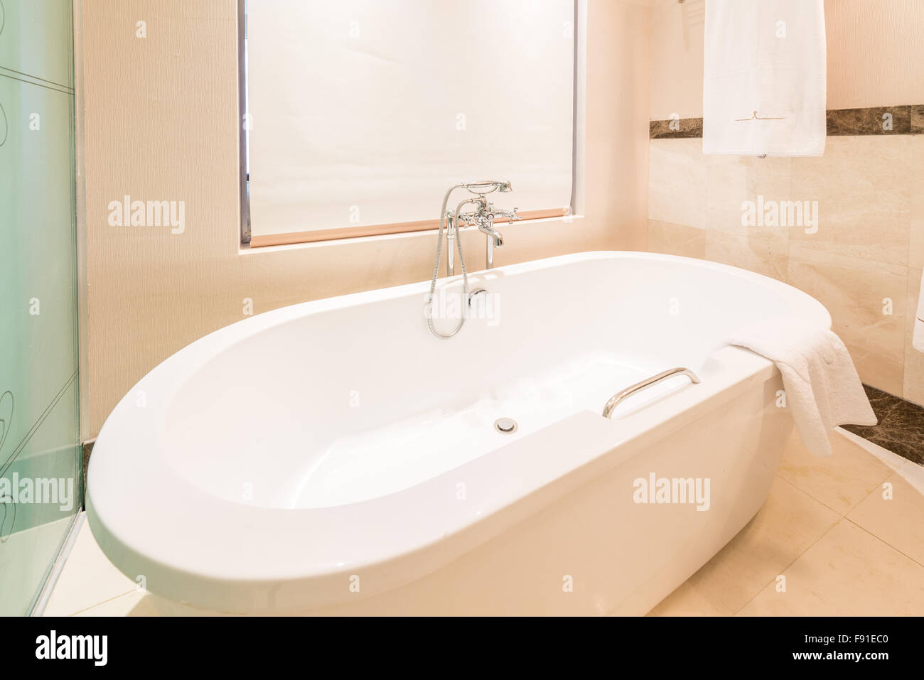 Modern bathroom interior with bathtub Stock Photo - Alamy