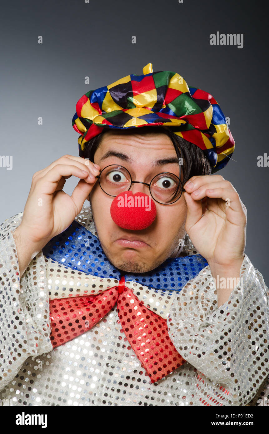 Funny clown against dark background Stock Photo - Alamy