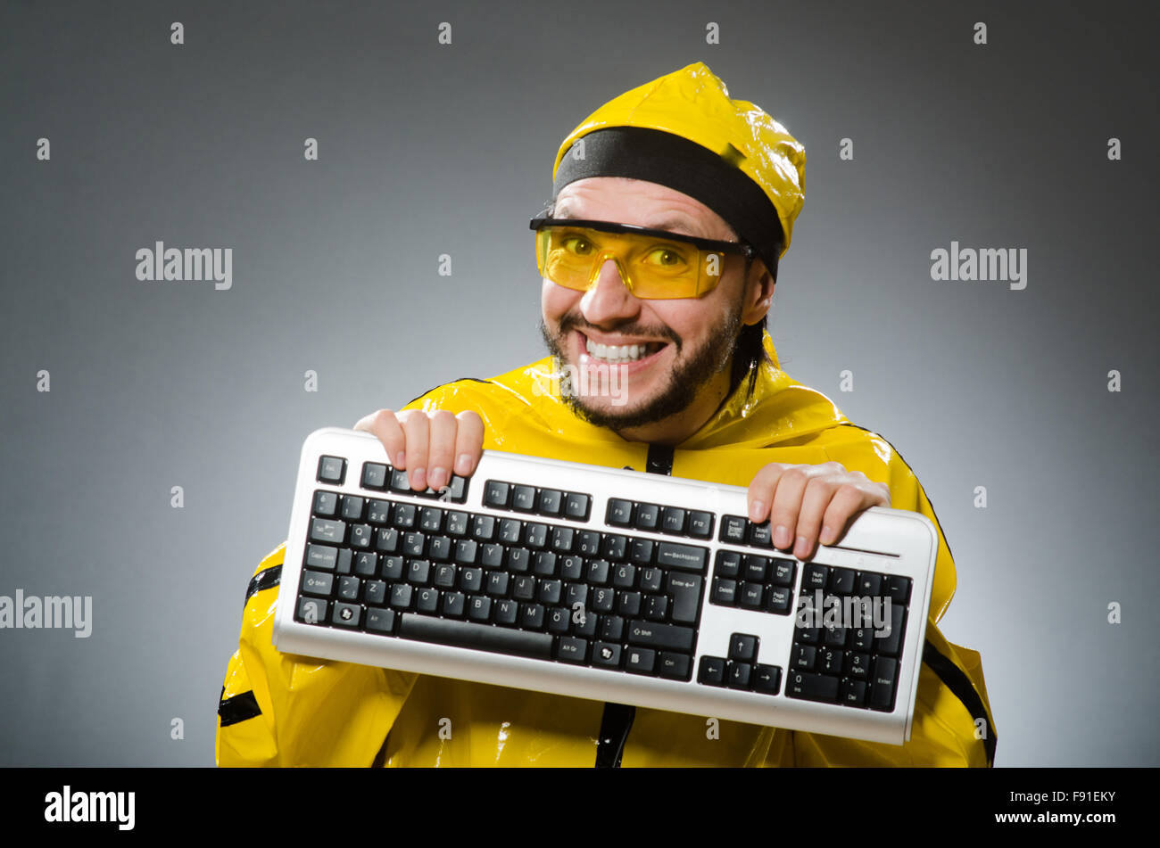 Man wearing yellow suit with keyboard Stock Photo - Alamy
